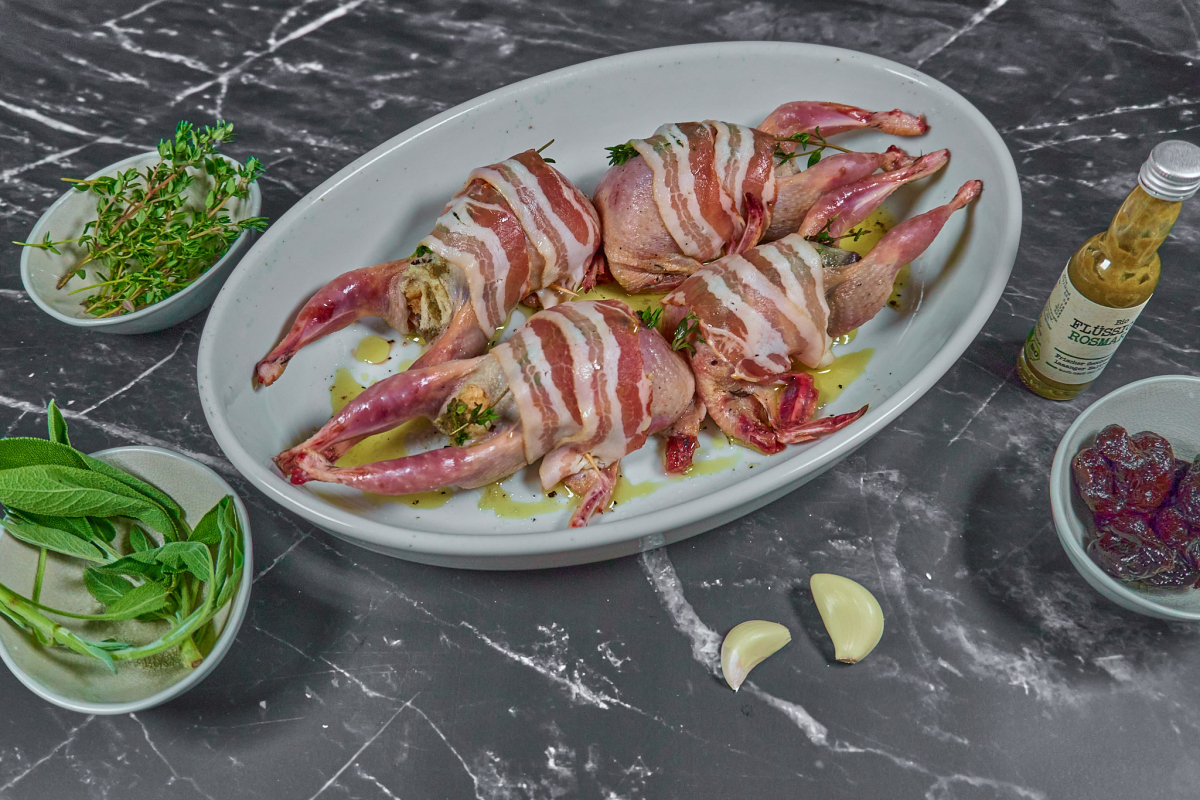 Roasted Stuffed Quail Wrapped in Bacon - Cuisine Reinvented