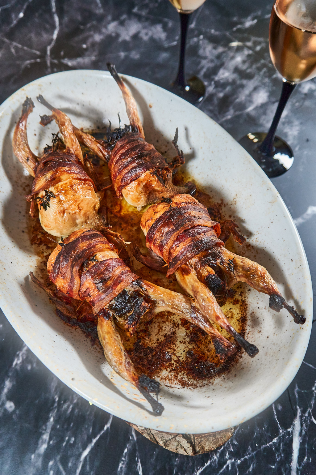 Roasted Stuffed Quail Wrapped in Bacon - Cuisine Reinvented